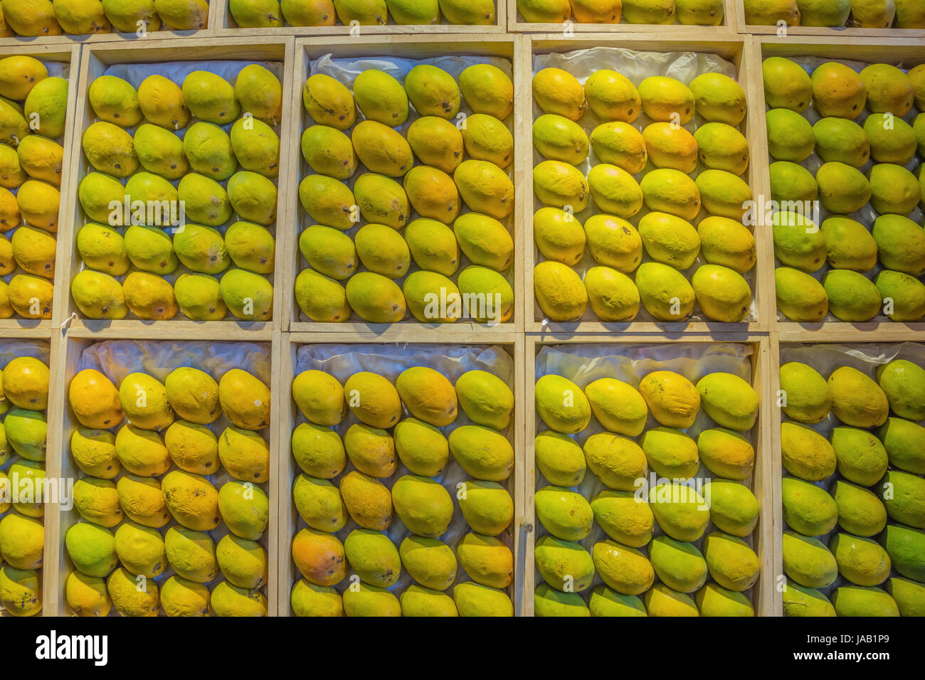 An array of mangos in wooden boxes on the market Stock Photo - Alamy
