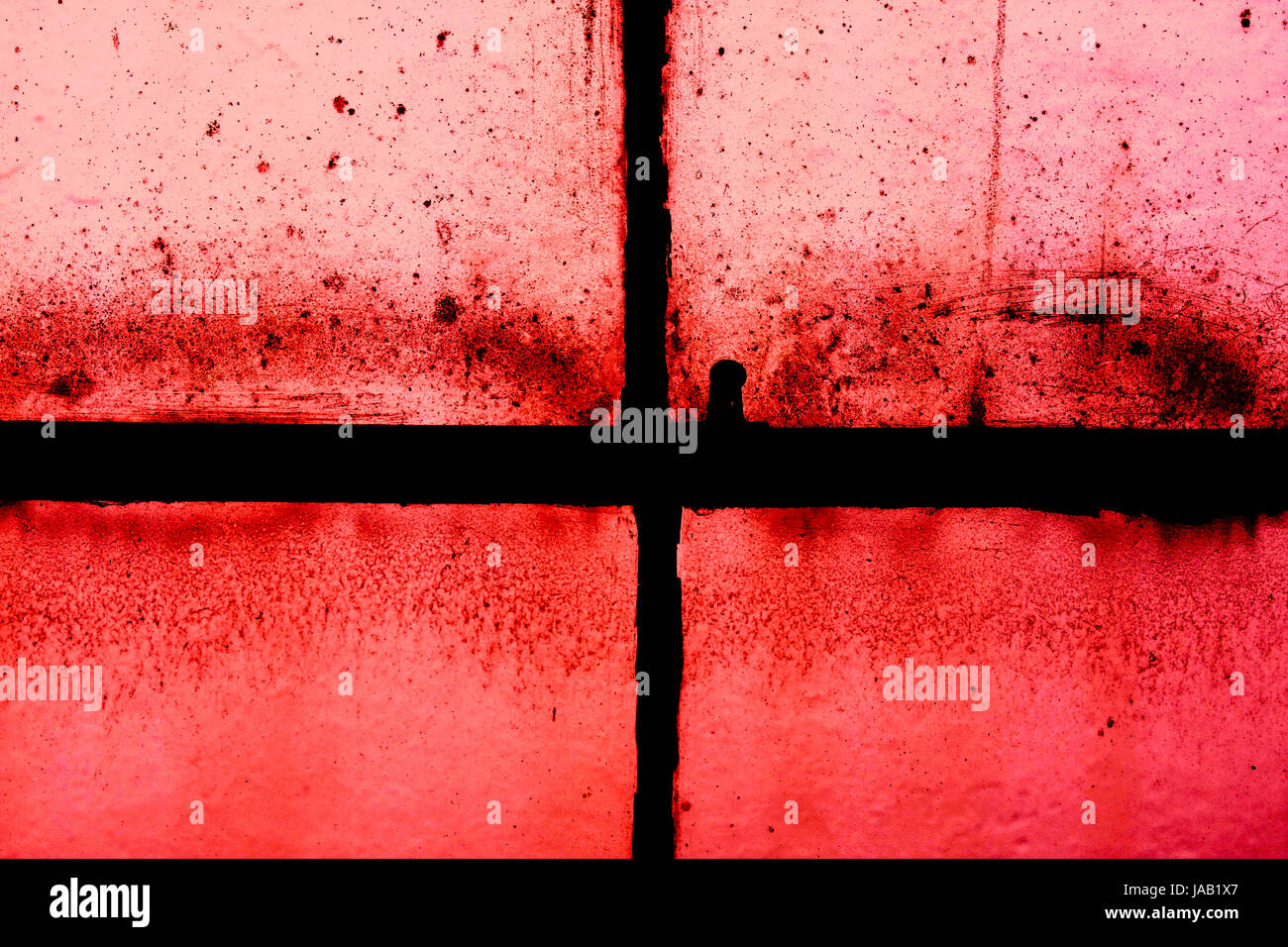 Dirty old sash window frame silhouetted against a red background Stock ...