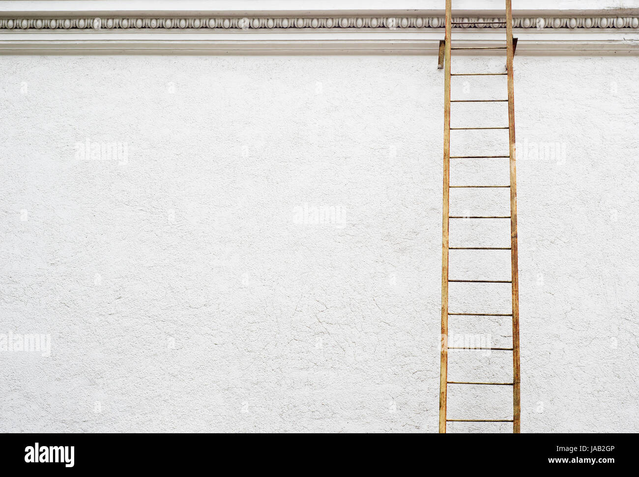 White stucco wall with metal ladder Stock Photo - Alamy