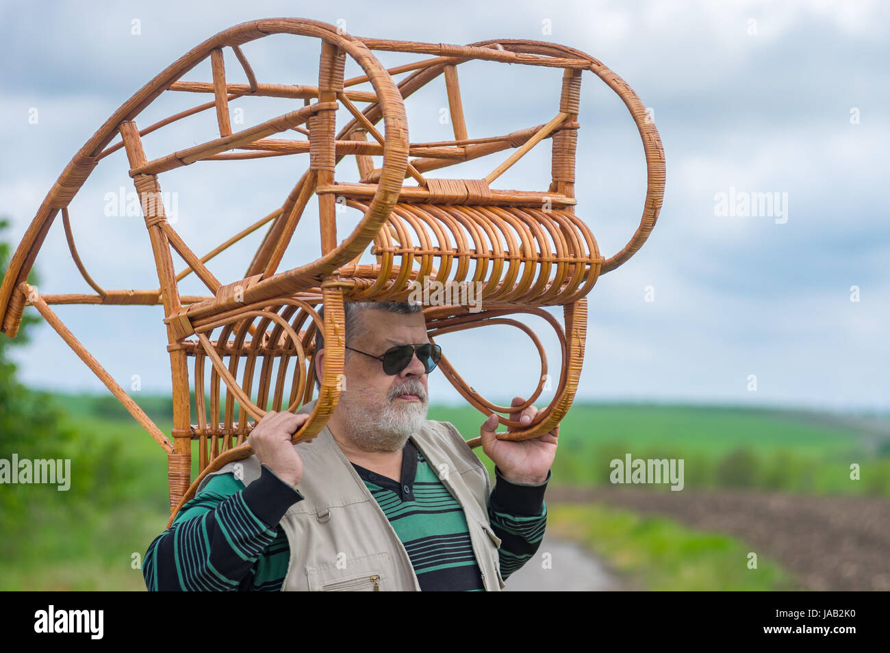 Man carry chair hi-res stock photography and images - Alamy