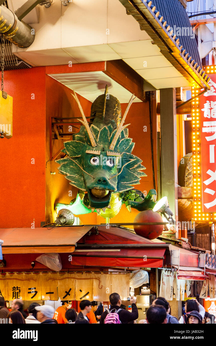 Japan, Osaka, Dotonbori. Night time. Kinryu Ramen takeaway counter and ...
