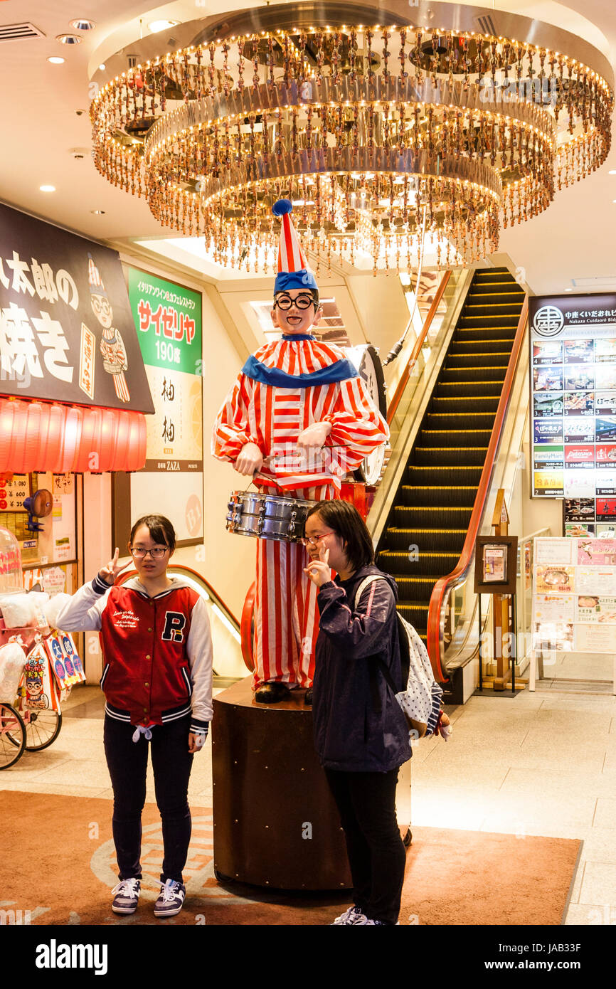 Japan, Osaka, Dotonbori. Night time. People posing in front of famous ...