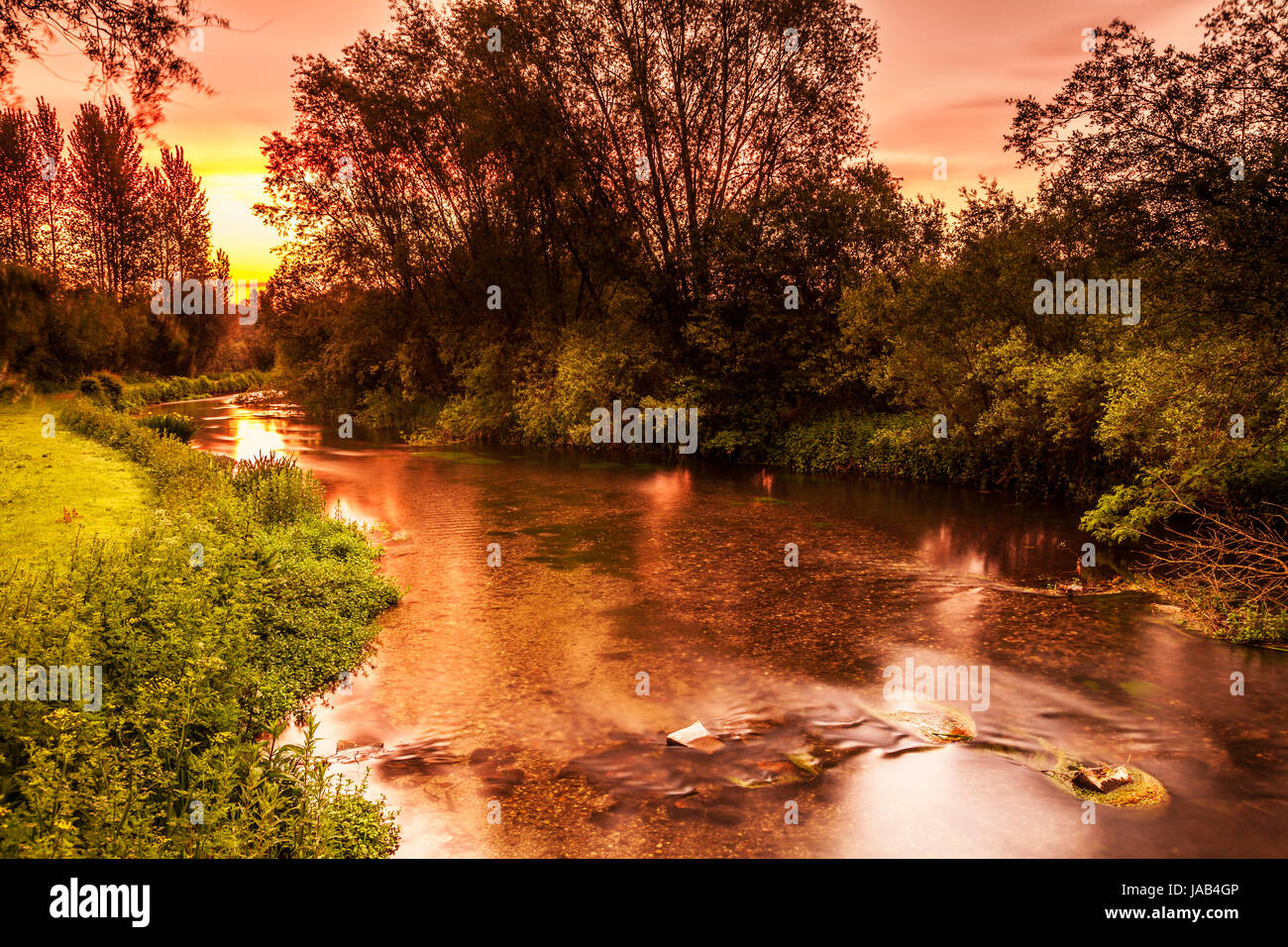 A colourful and dramatic sunrise over the River Kennet in Wiltshire ...