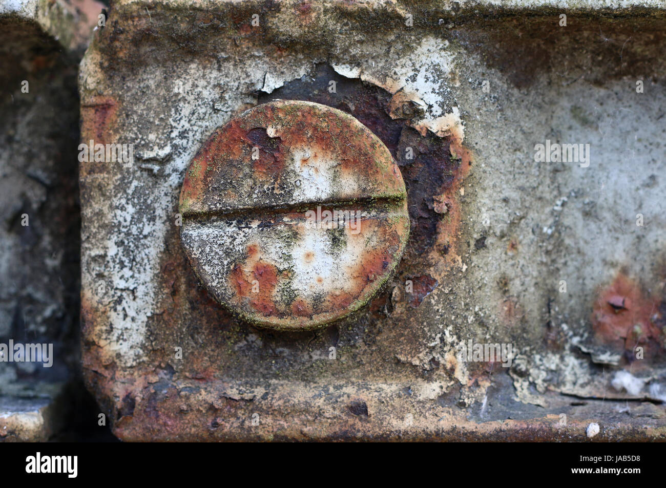 Detail of a rusty screw on an iron structure Stock Photo - Alamy