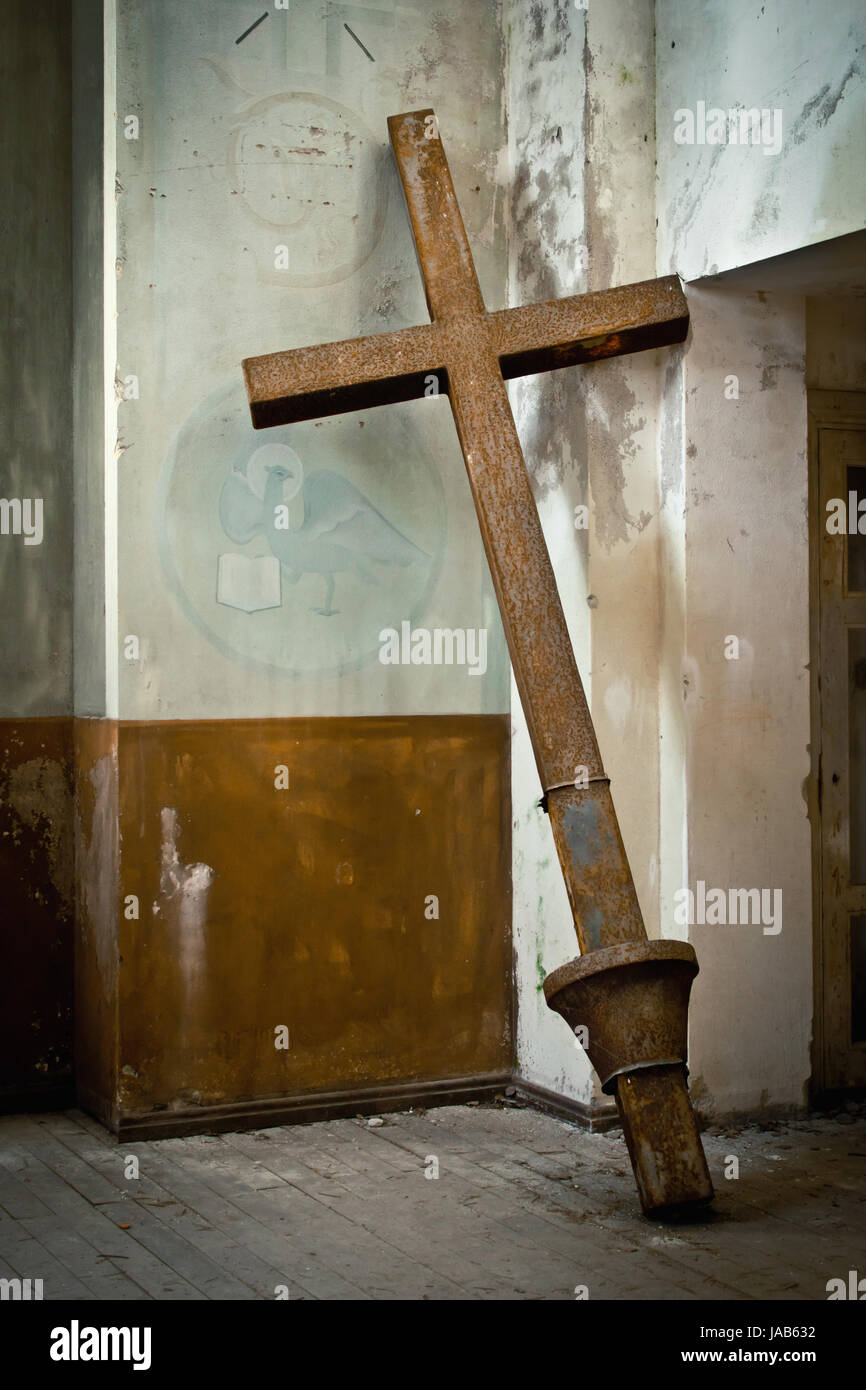 A large wooden cross in the corner of an abandoned church Stock Photo ...