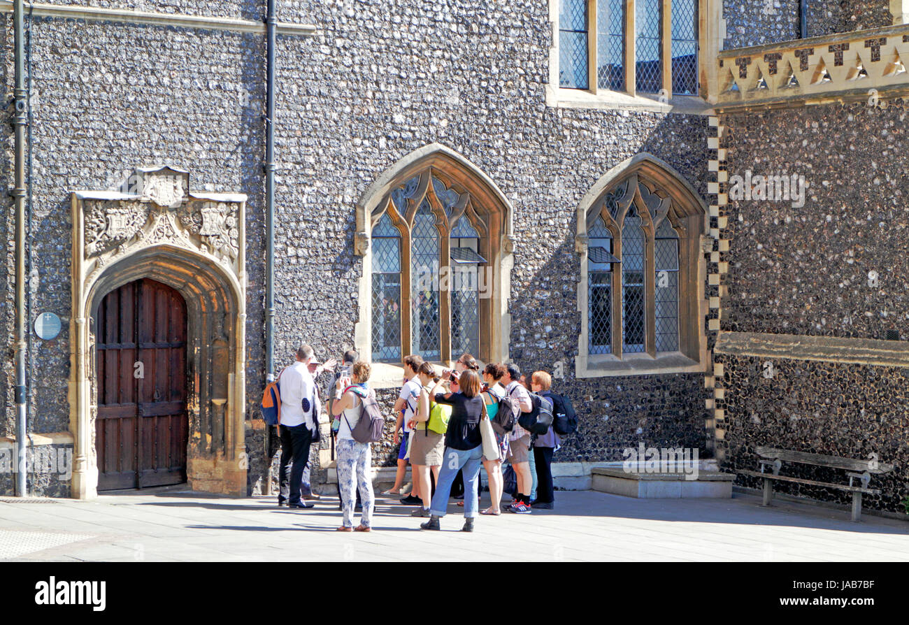 A group on a guided tour outside the Guildhall in the centre of the ...