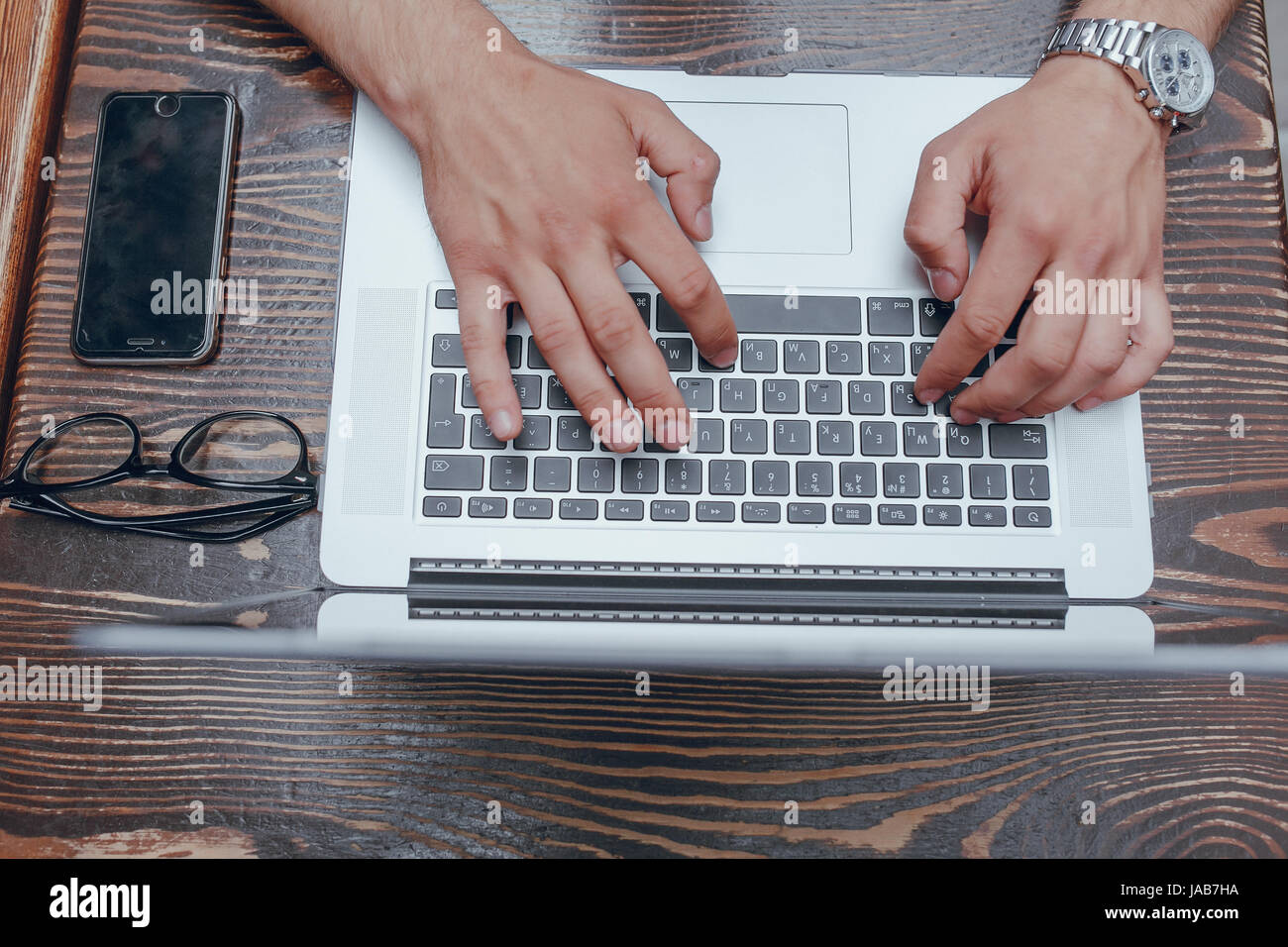 young bank employee busy on a laptop during lunch break Stock Photo - Alamy
