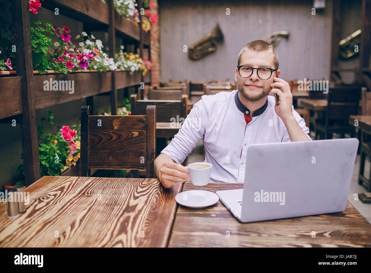 a young bank employee busy on a laptop during lunch break Stock Photo ...