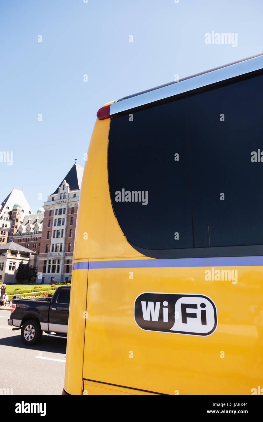 Yellow bus with wifi decal on side. Victoria BC Stock Photo - Alamy