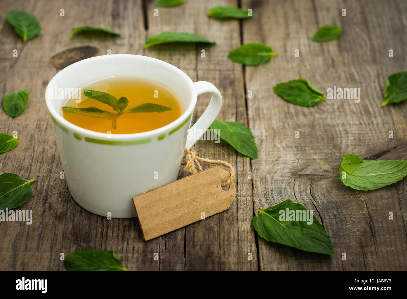 A cup of mint tea on wood textured background Stock Photo - Alamy
