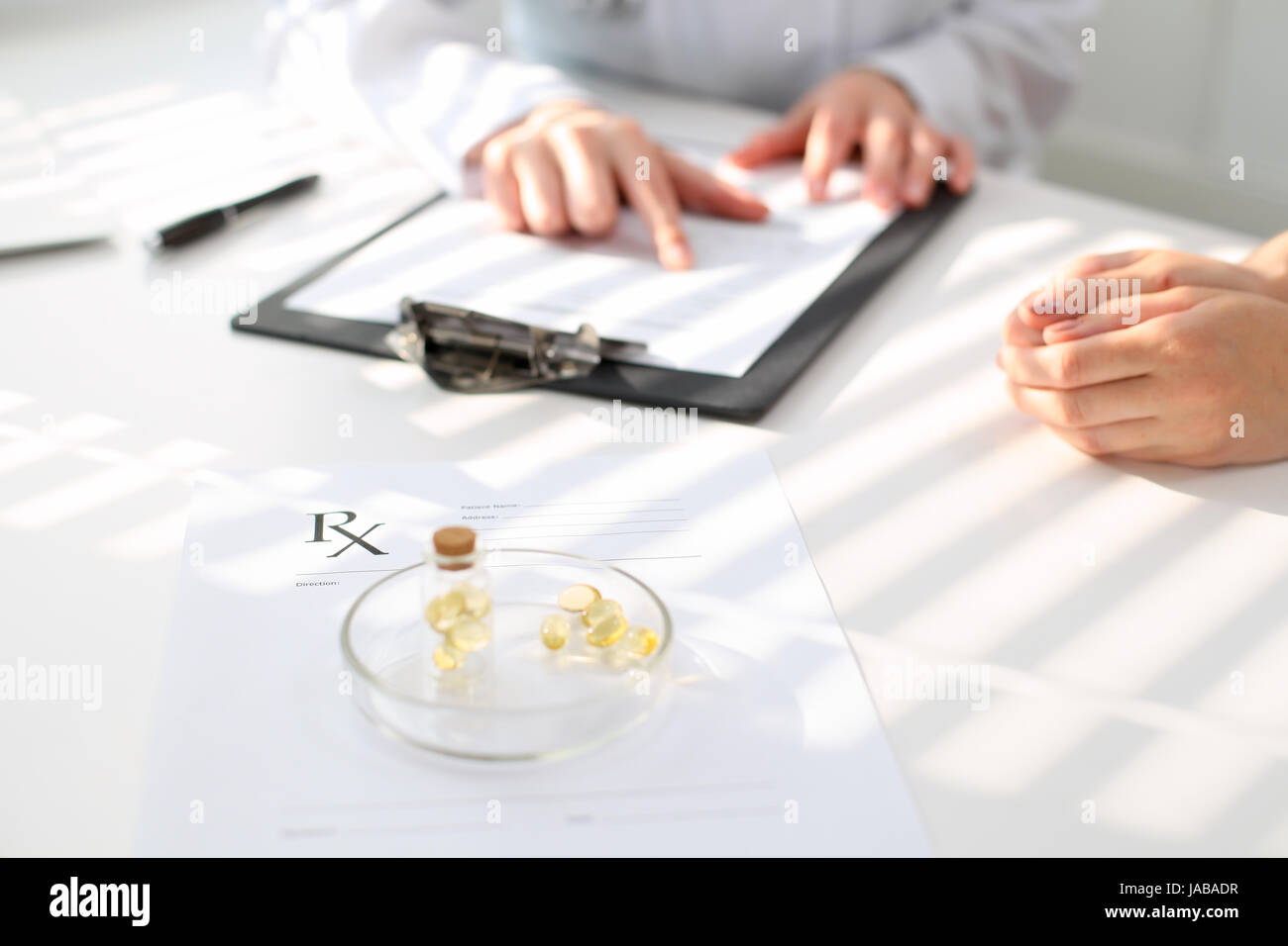 Medicine capsules and pills are lying against the background of a ...