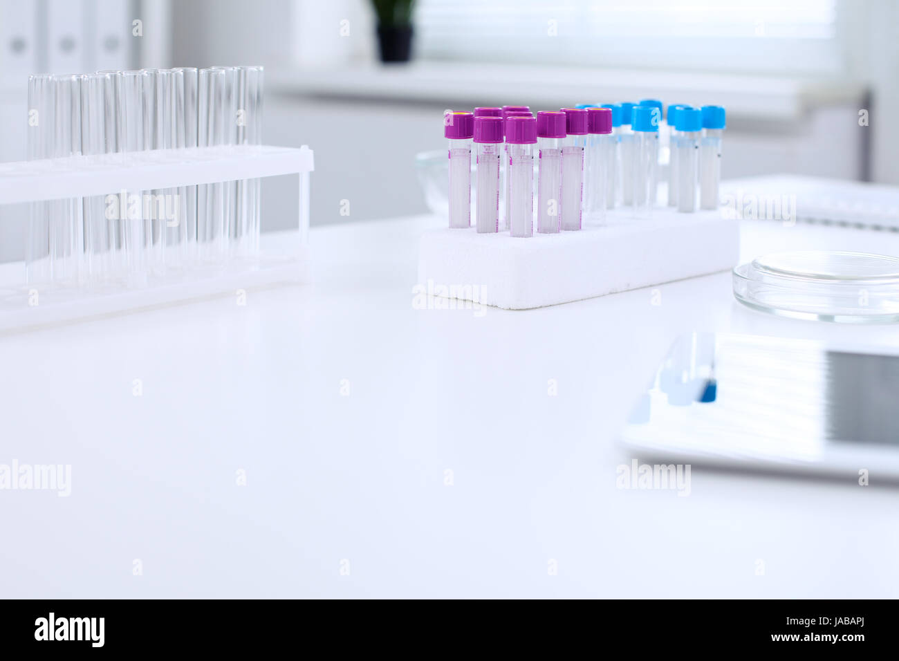 Research laboratory working space. Test tubes and tablet PC are lying ...