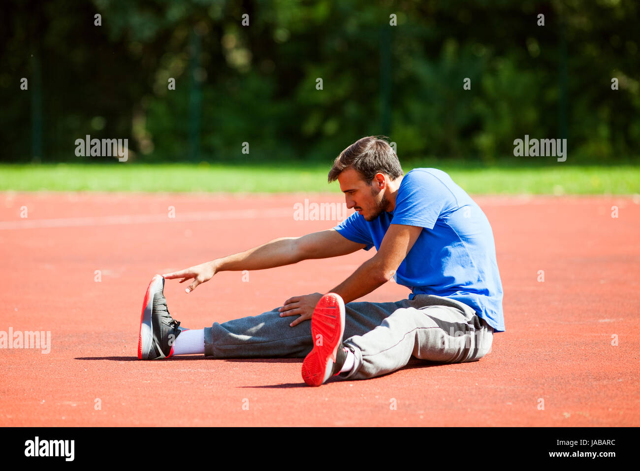 Young man warming up in hi-res stock photography and images - Alamy