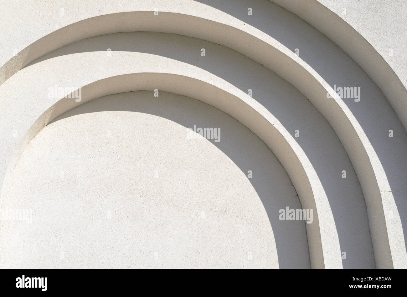 Abstract lines of arches in a white plastered wall. Abstract background ...