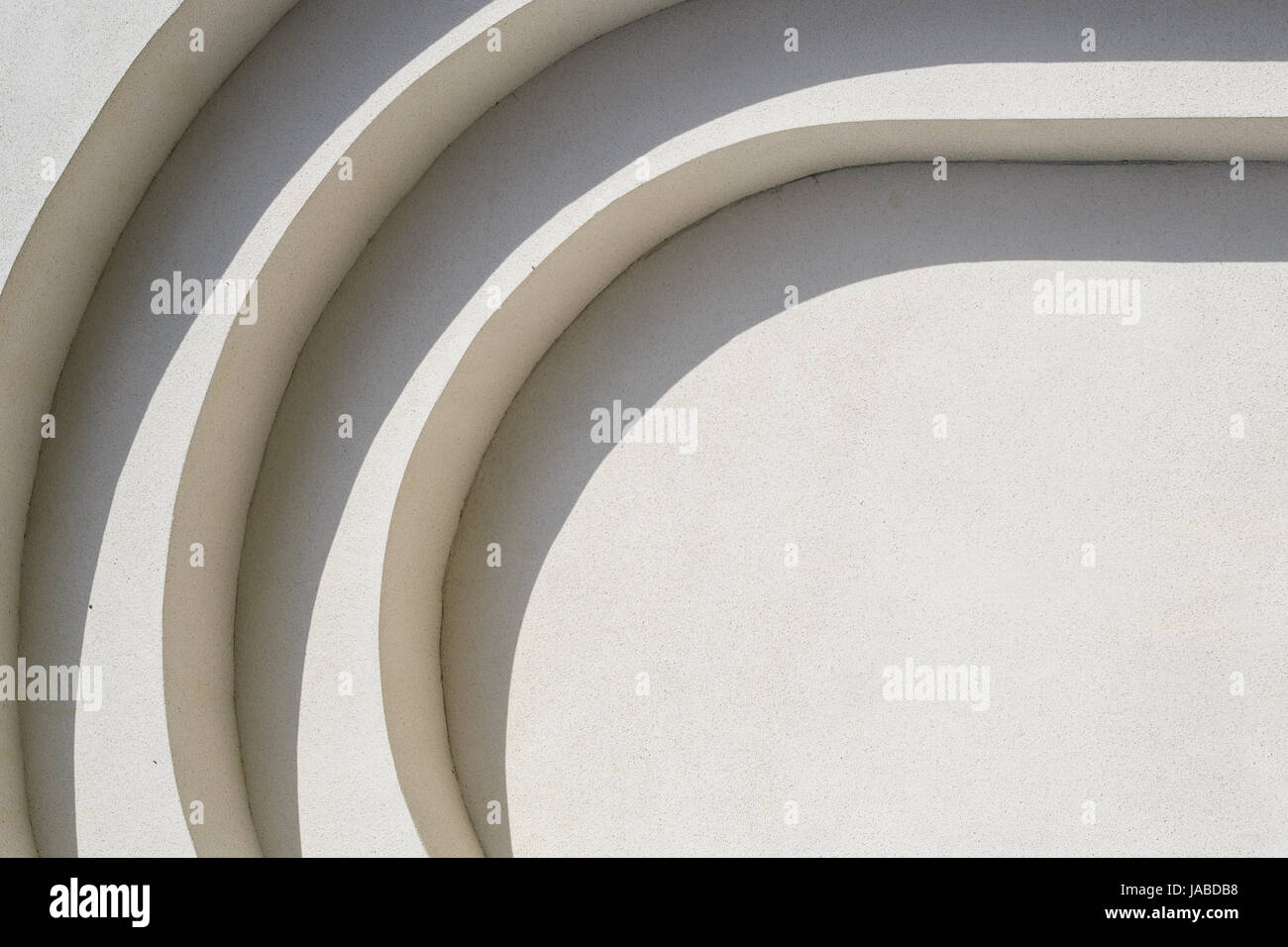 Abstract lines of arches in a white plastered wall. Abstract background ...