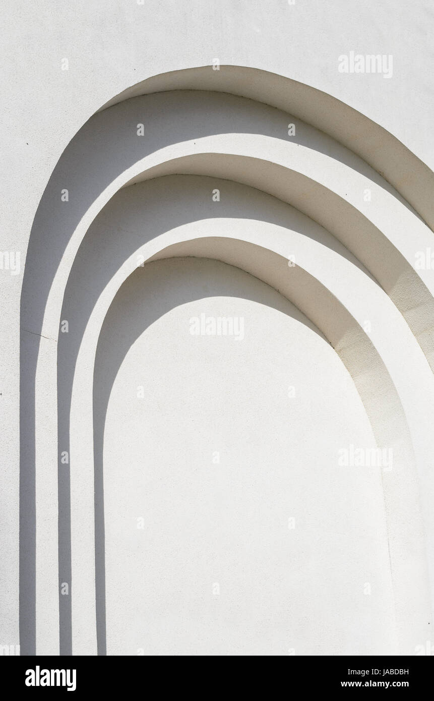 Abstract lines of arches in a white plastered wall. Abstract background ...