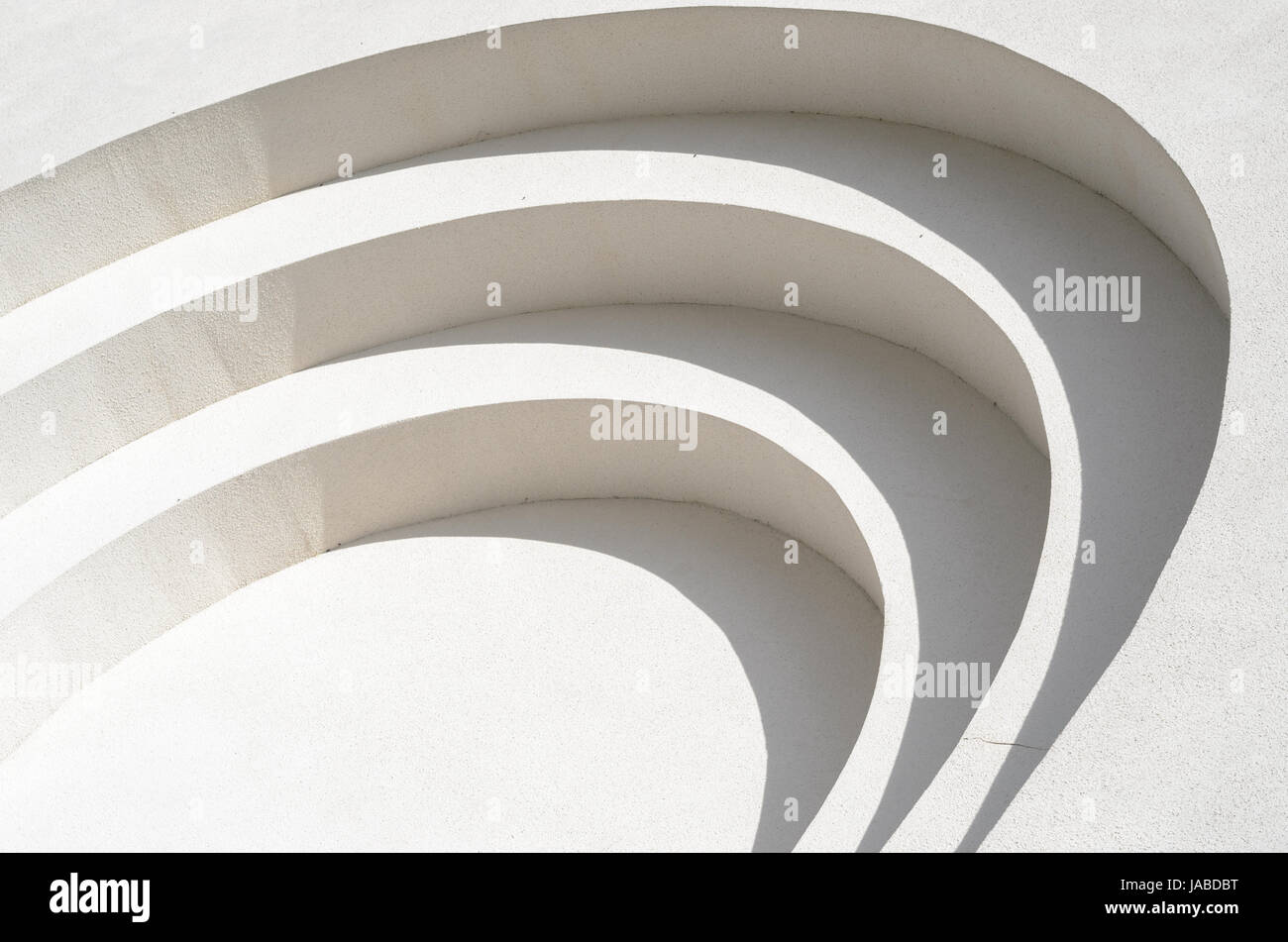 Abstract lines of arches in a white plastered wall. Abstract background ...