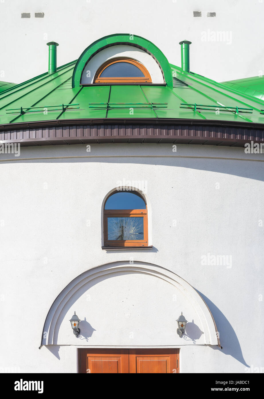 Latticed window in arches shape at white medieval church wall. Element ...