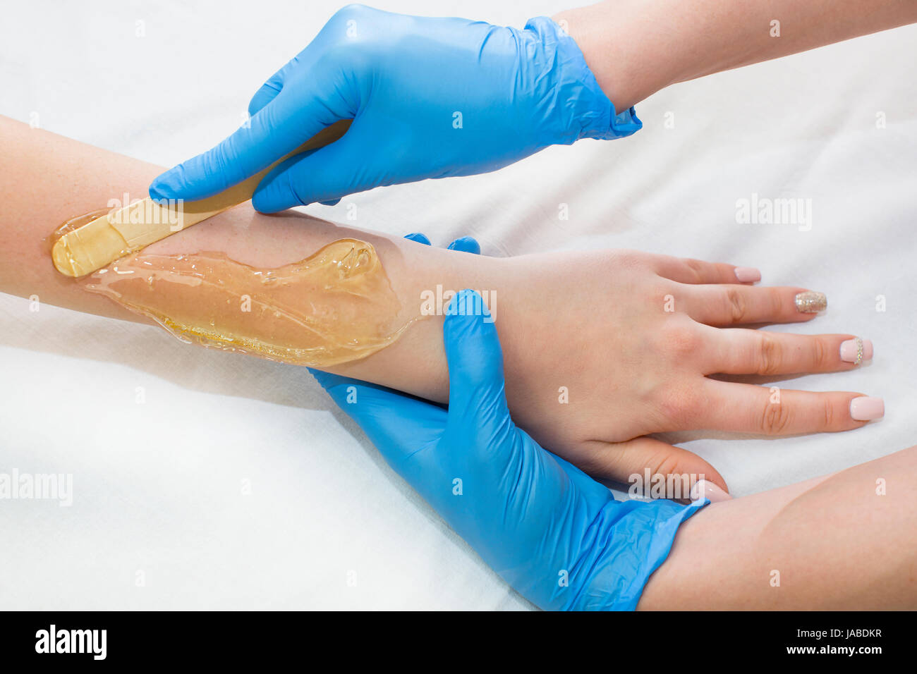 Epilation sugar processes woman passes hi-res stock photography and ...