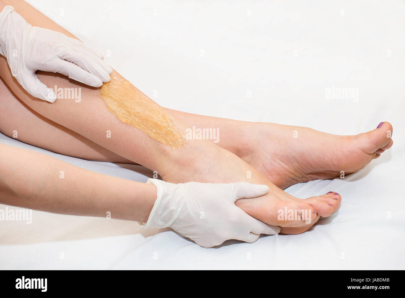 Process depilation female legs and hands in a beauty salon Stock Photo ...