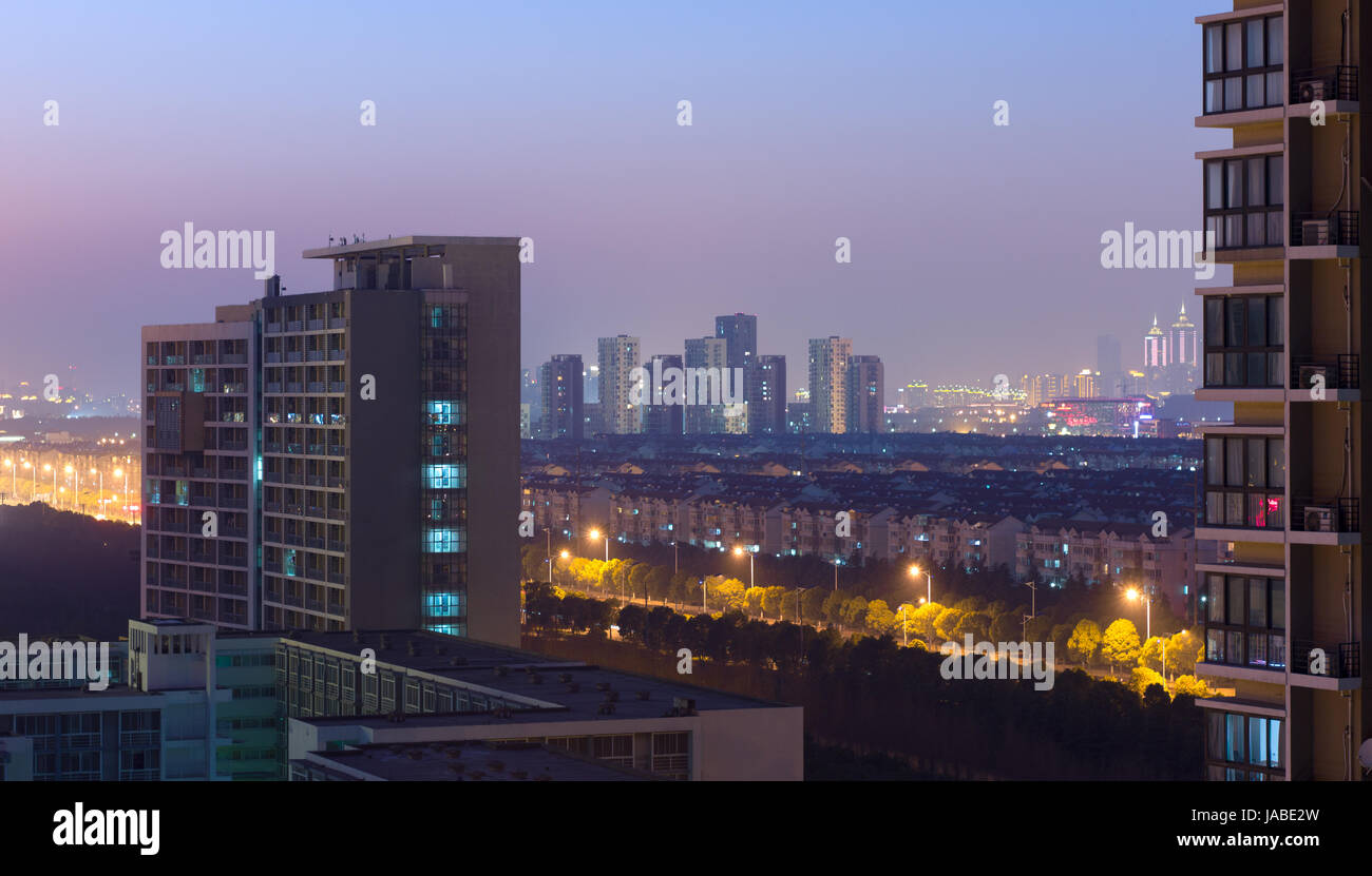 Polluted air hanging over high and low rise apartment buildings at dusk ...