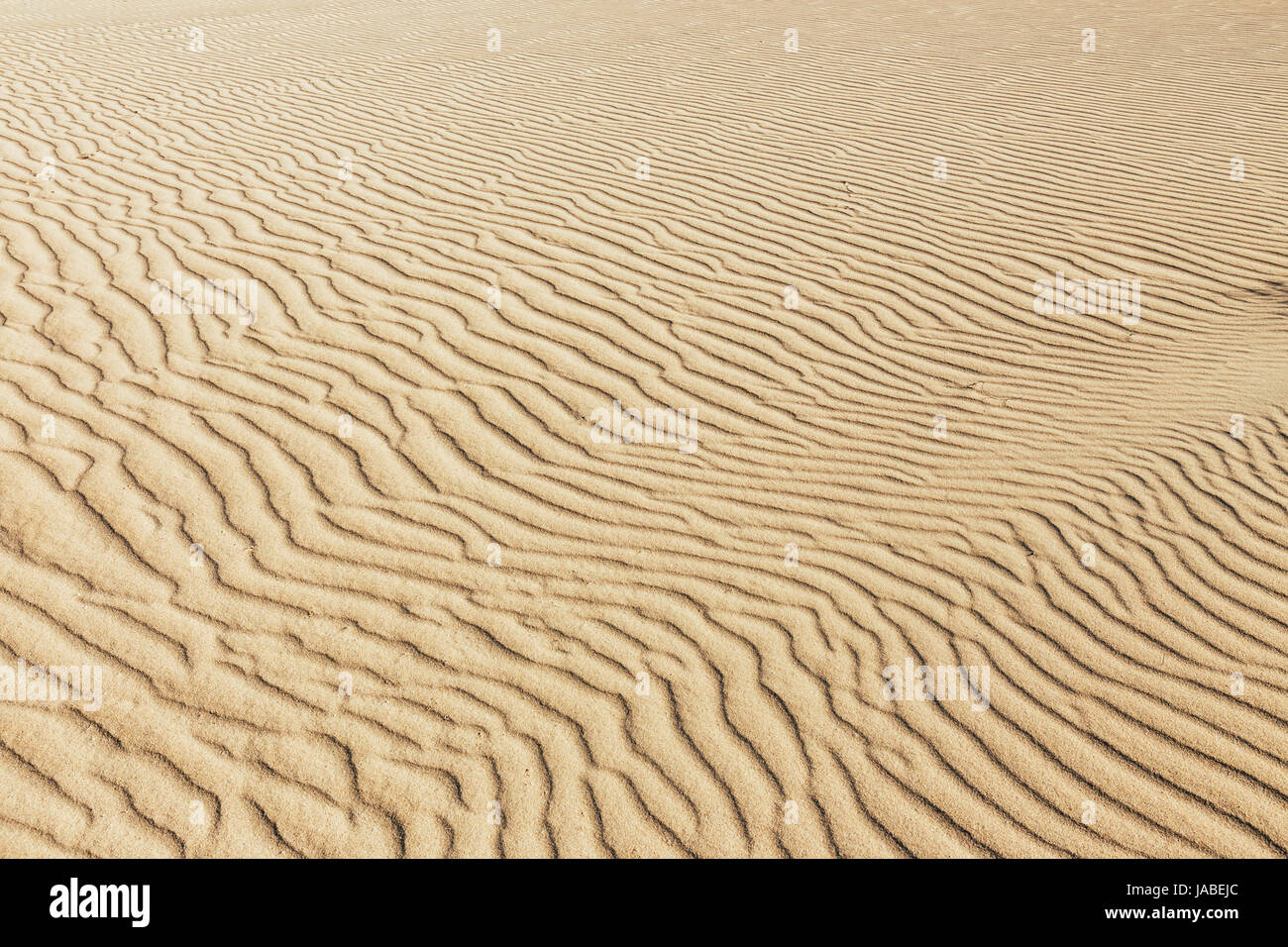 Lines in the sand of a beach, close up Stock Photo - Alamy