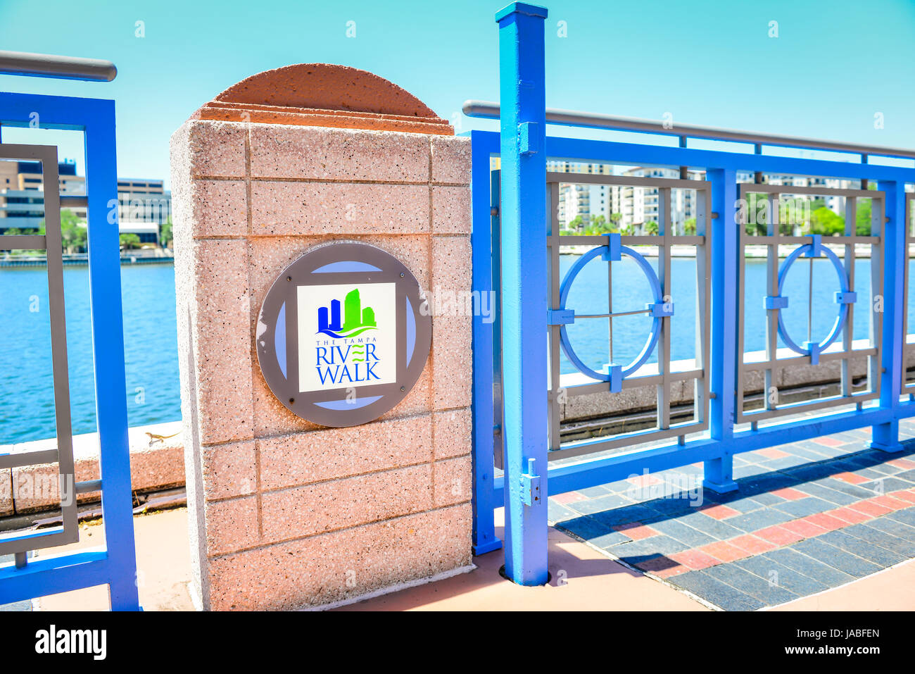 A sign reads "Tampa River Walk" along the Riverwalk pathway on the ...