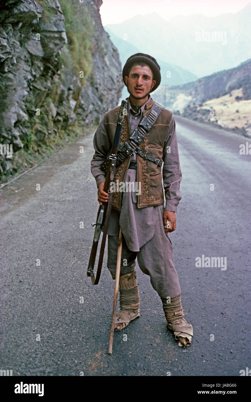 Armed tribesman with his goats, Karakoram Highway, Gilgit-Baltistan ...