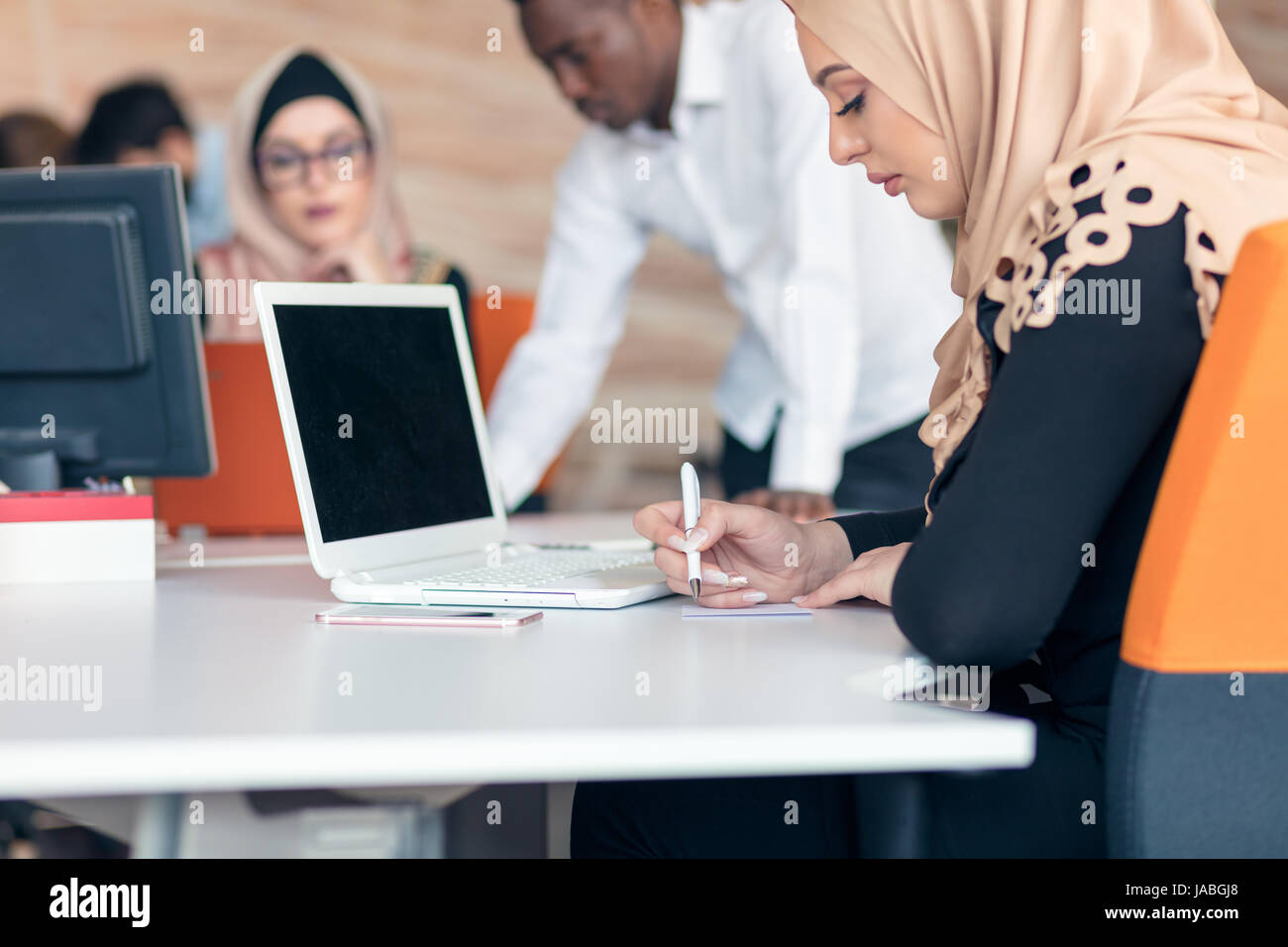 Young Arabic business woman wearing hijab,working in her startup office ...