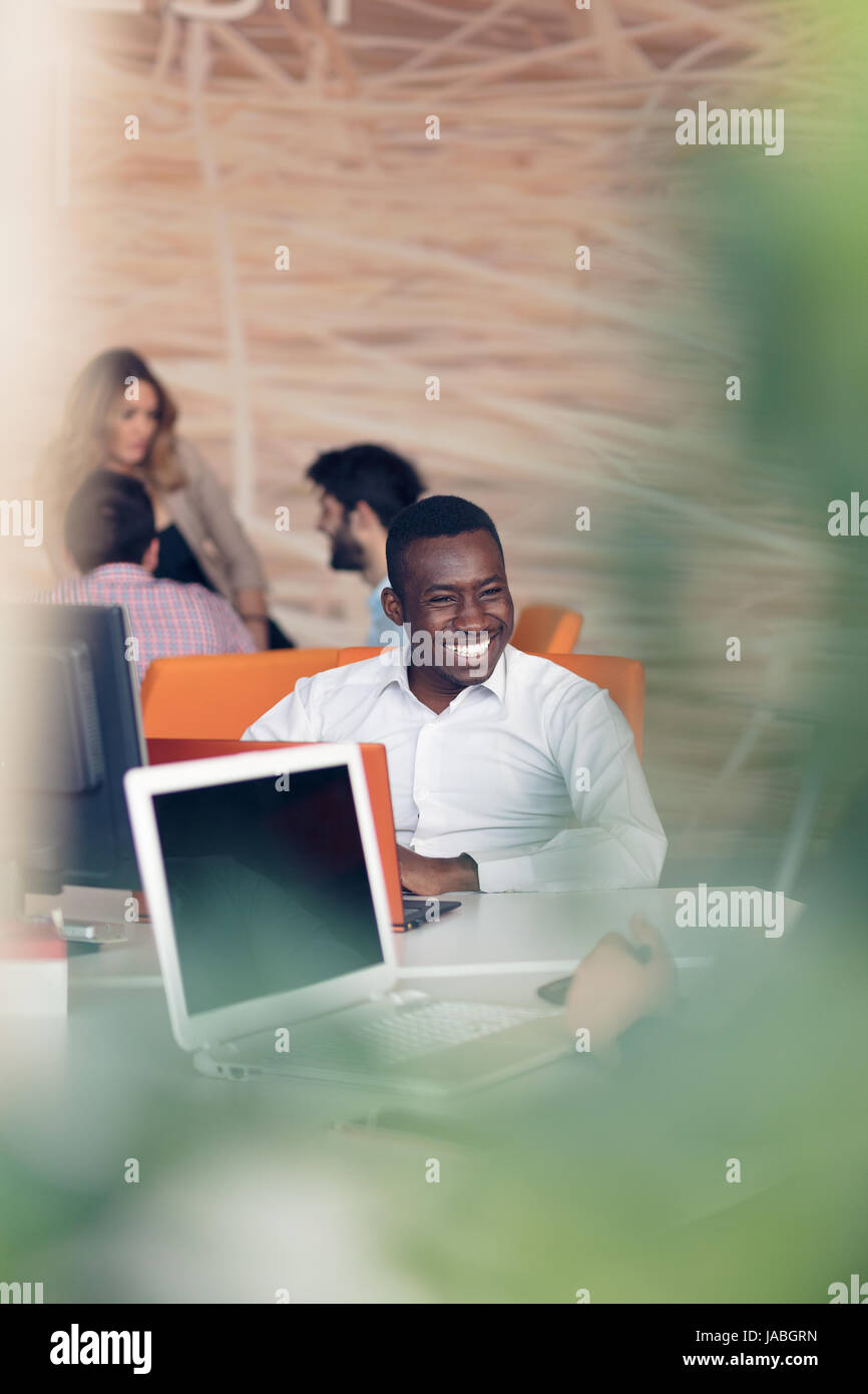 Young African-American business man taking a break at his desk Stock ...