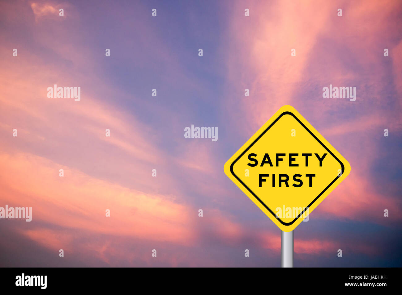 Safety first wording on yellow transportation sign with violet cloud ...