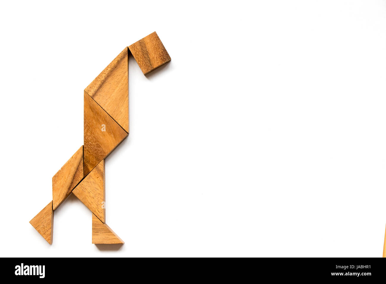 Wooden tangram as anxiety man shape on white background (Concept as ...
