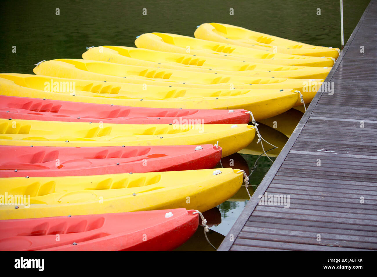 Group of red, yellow color Kayak stop at the port Stock Photo - Alamy