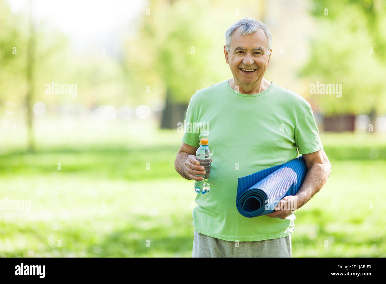 Senior man is ready for exercise in park. Active retirement Stock Photo ...