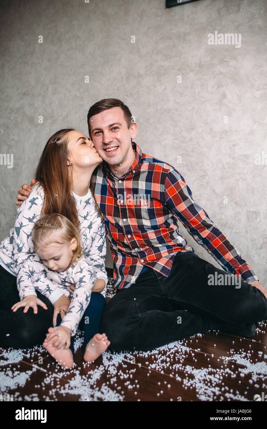Happy family playing together on the floor Stock Photo - Alamy