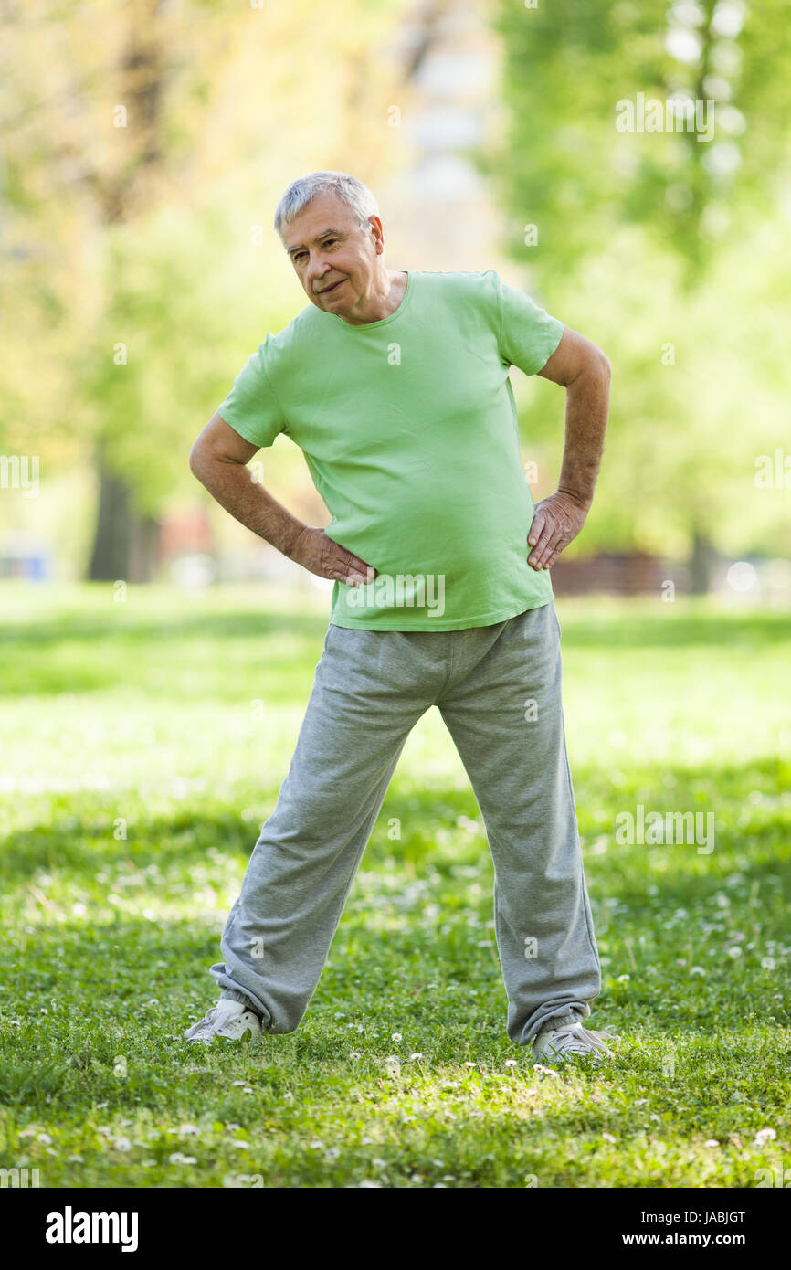 Senior man is exercising in park. Active retirement Stock Photo - Alamy