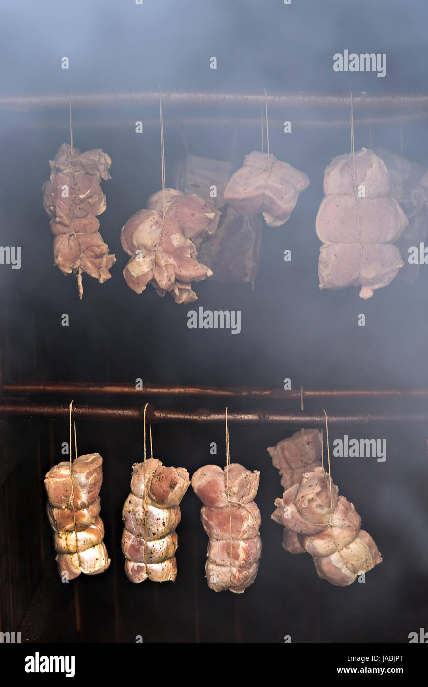smoking meat in the traditional smokehouse Stock Photo - Alamy