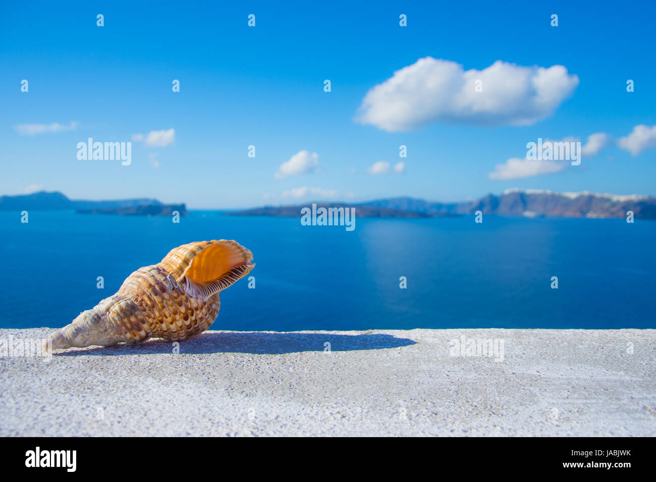 A seashell on a ledge with ocean background, Santorini, Greece Stock ...