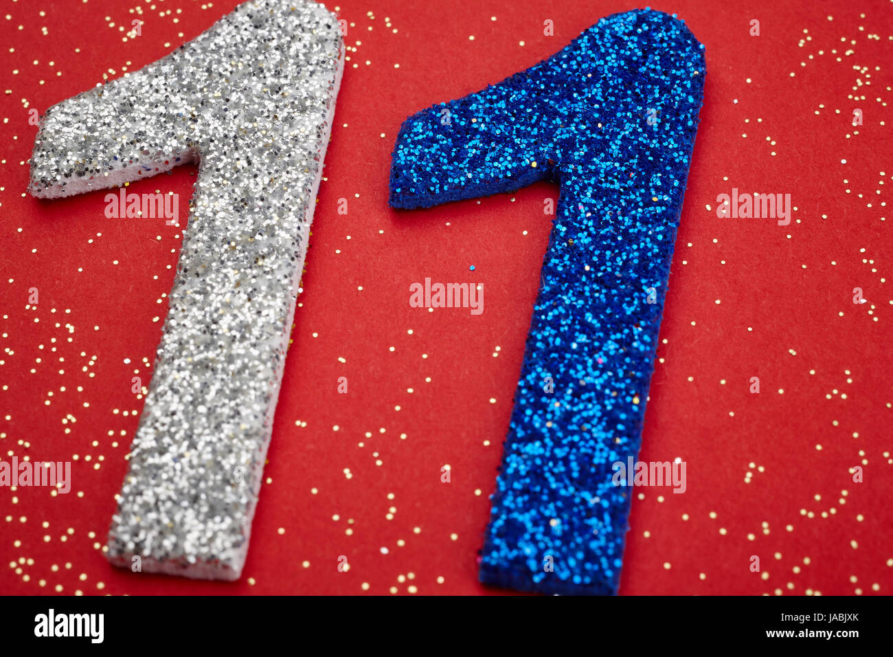 Number eleven silver blue color over a red background. Anniversary ...