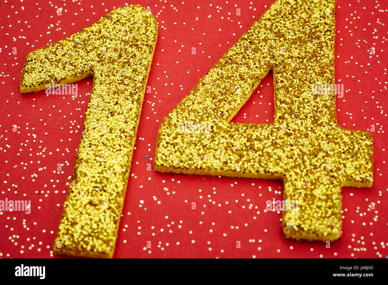 Number fourteen yellow color over a red background. Anniversary ...