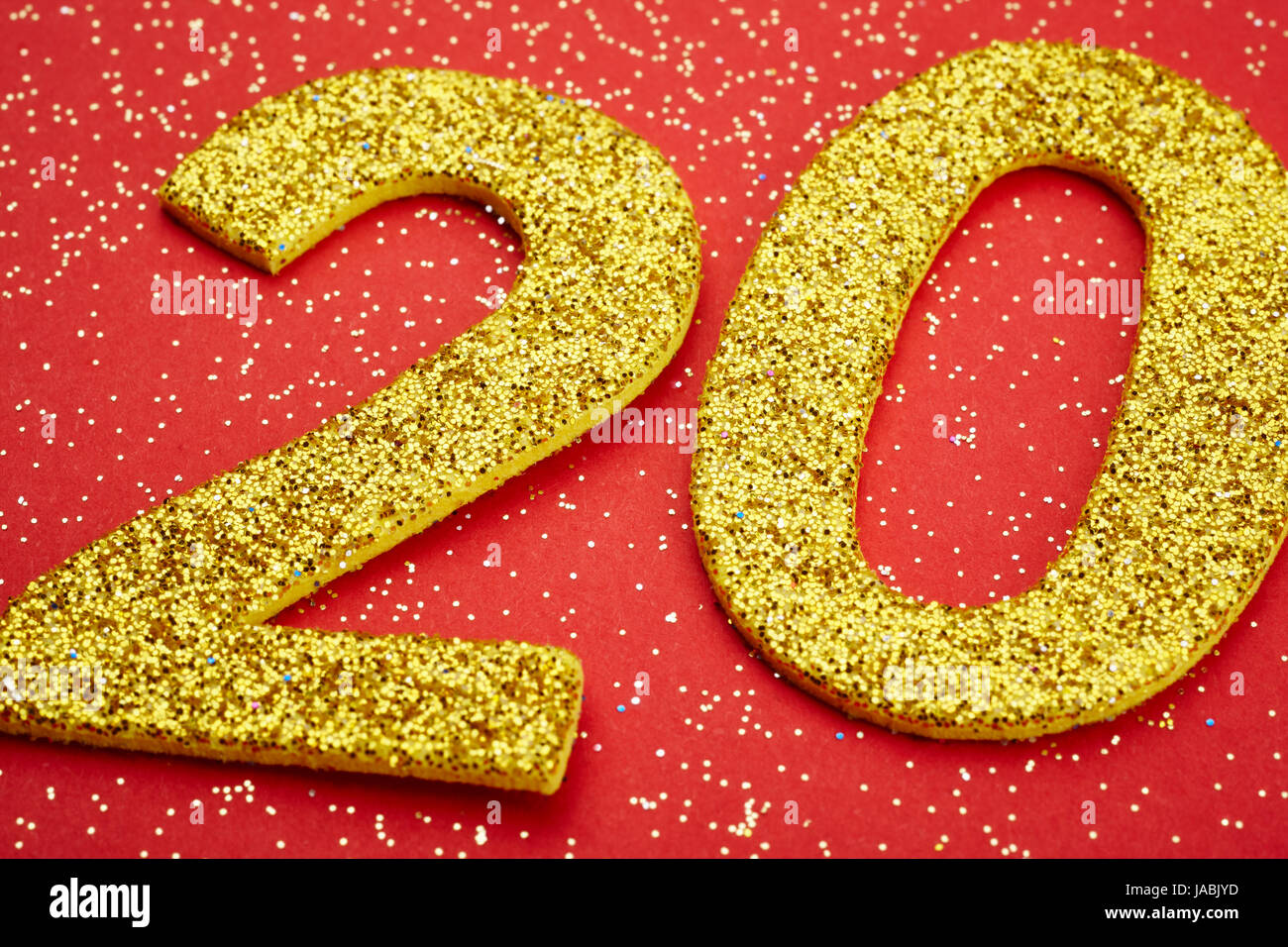 Number twenty yellow color over a red background. Anniversary ...