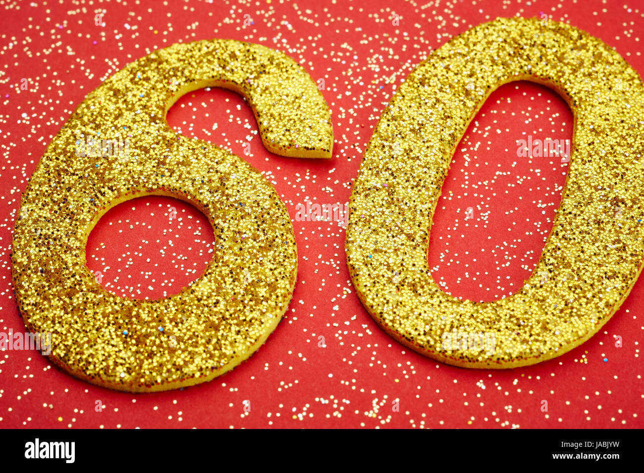 Number sixty golden color over a red background. Anniversary ...