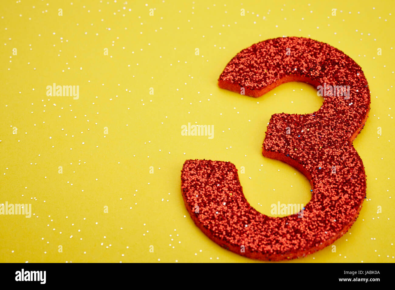 Number three red color over a yellow background. Anniversary ...