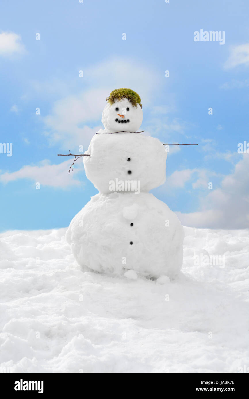 Snowman in front of blue sky Stock Photo - Alamy