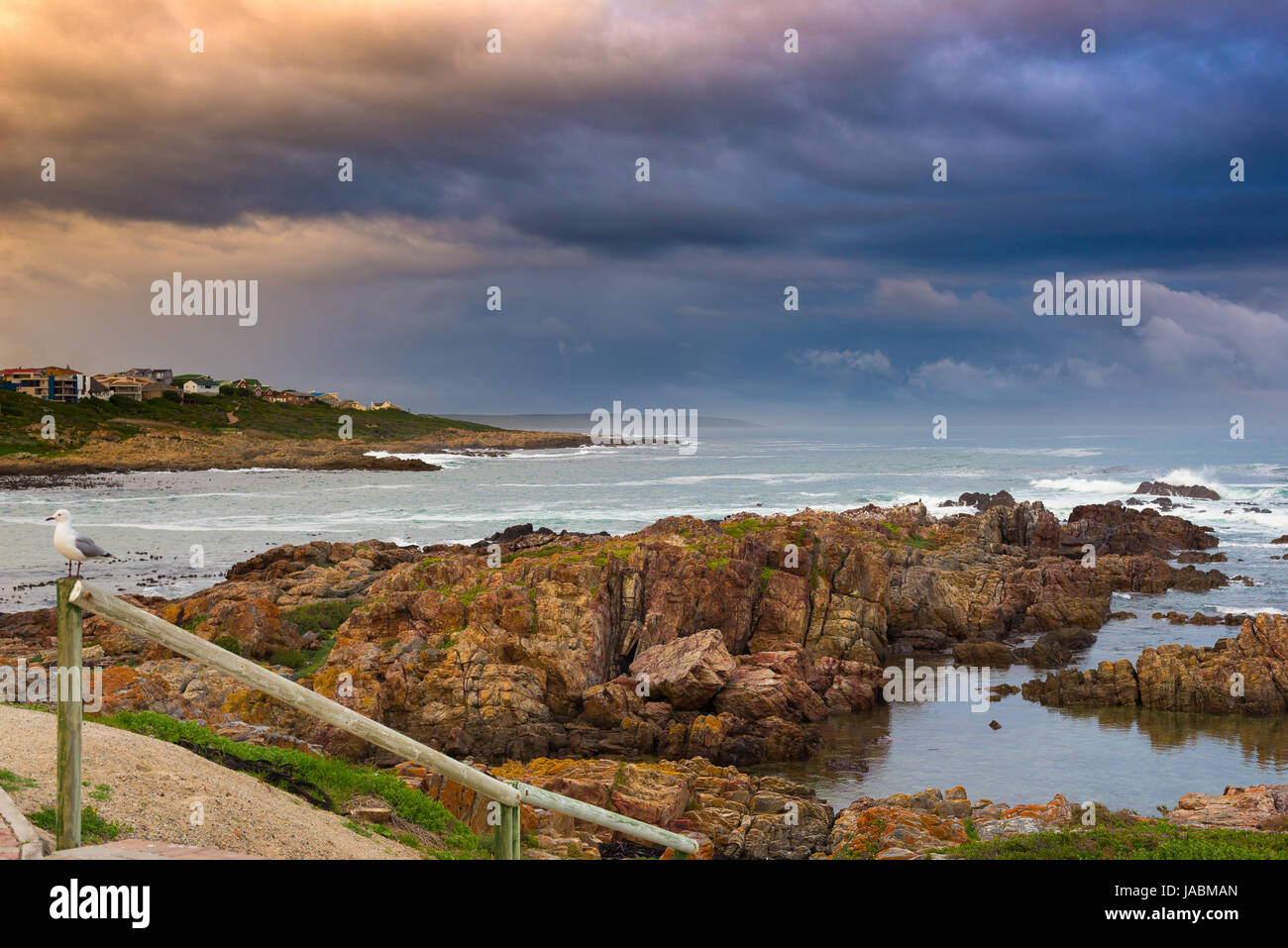 Rocky coast line on the ocean at De Kelders, South Africa, famous for whale watching. Winter ...