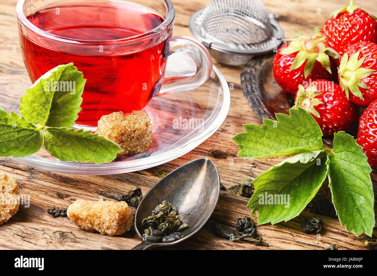 Summer fruit tea with strawberries in the rustic style Stock Photo - Alamy