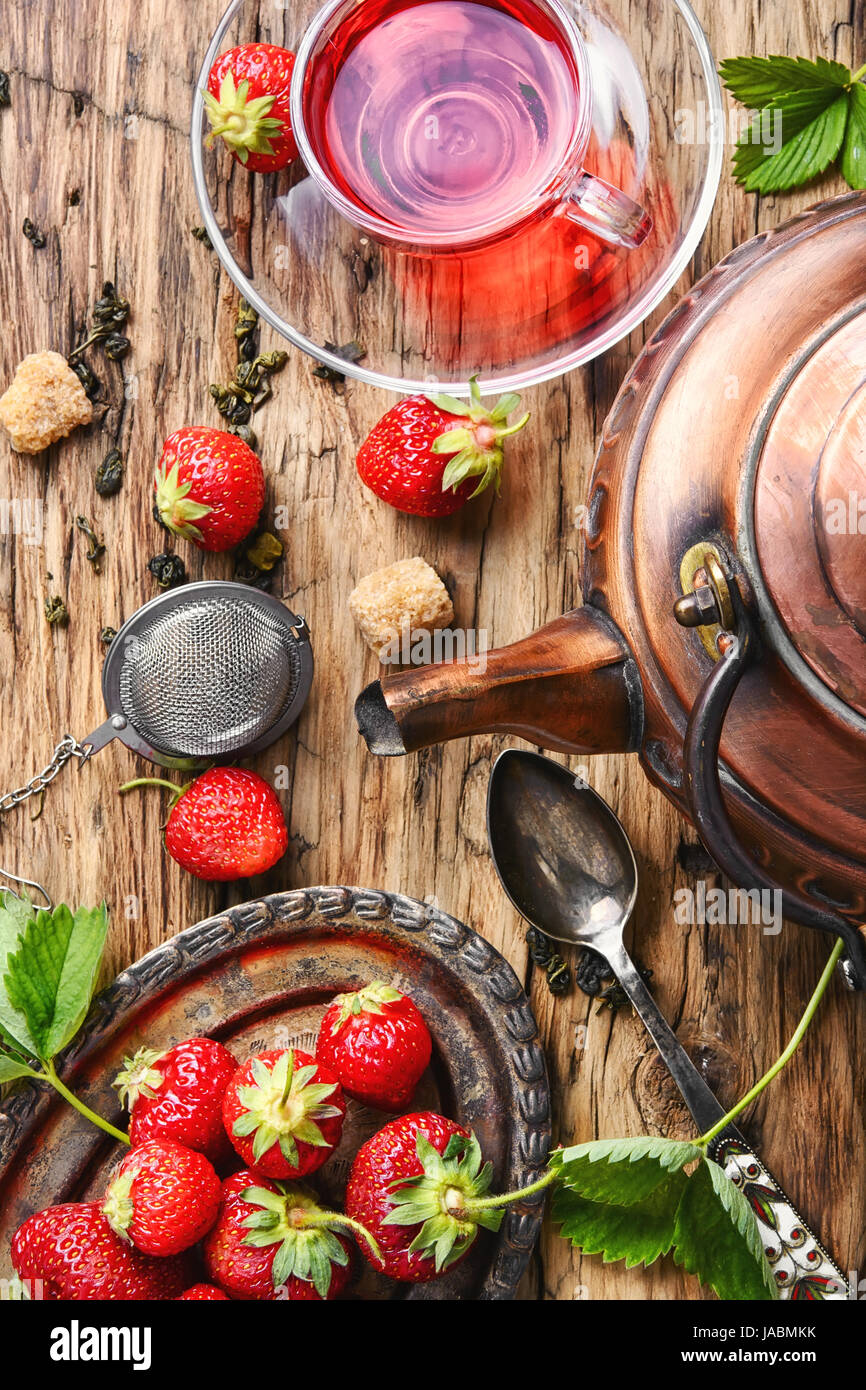 Summer fruit tea with strawberries in the rustic style Stock Photo - Alamy