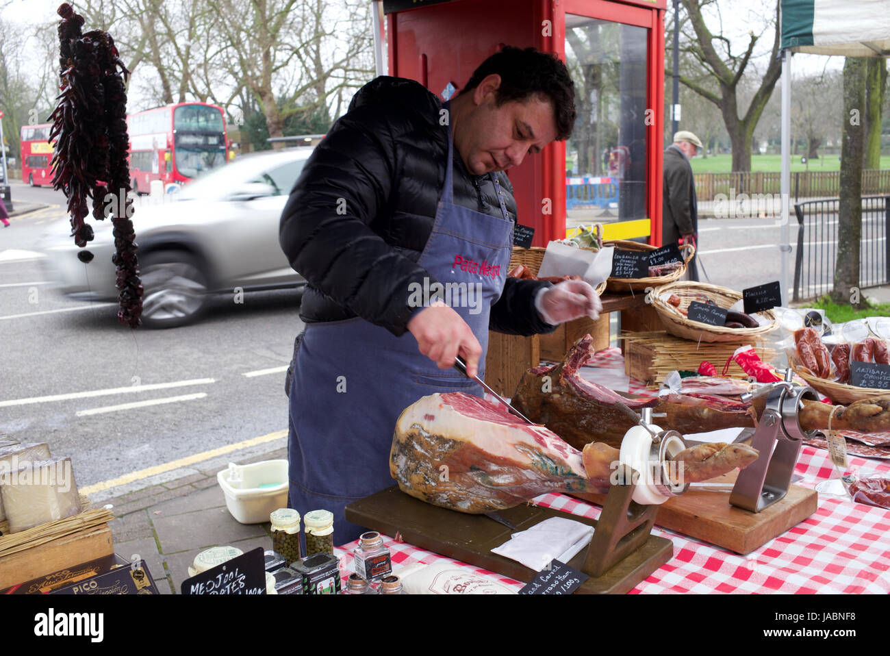 Man slicing ham Stock Photo - Alamy