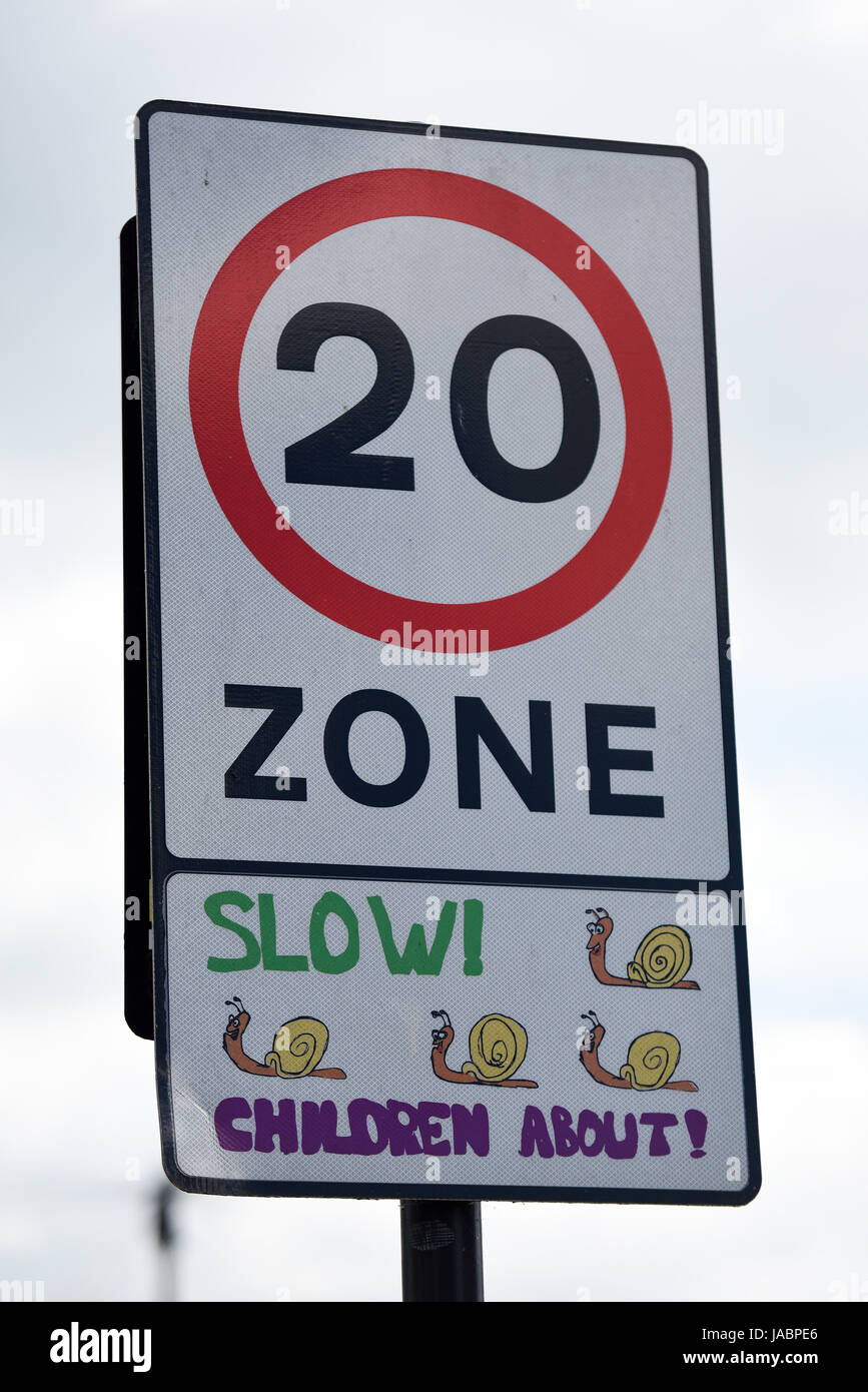 20mph speed limit zone sign with snails, slow, children about. Urban ...