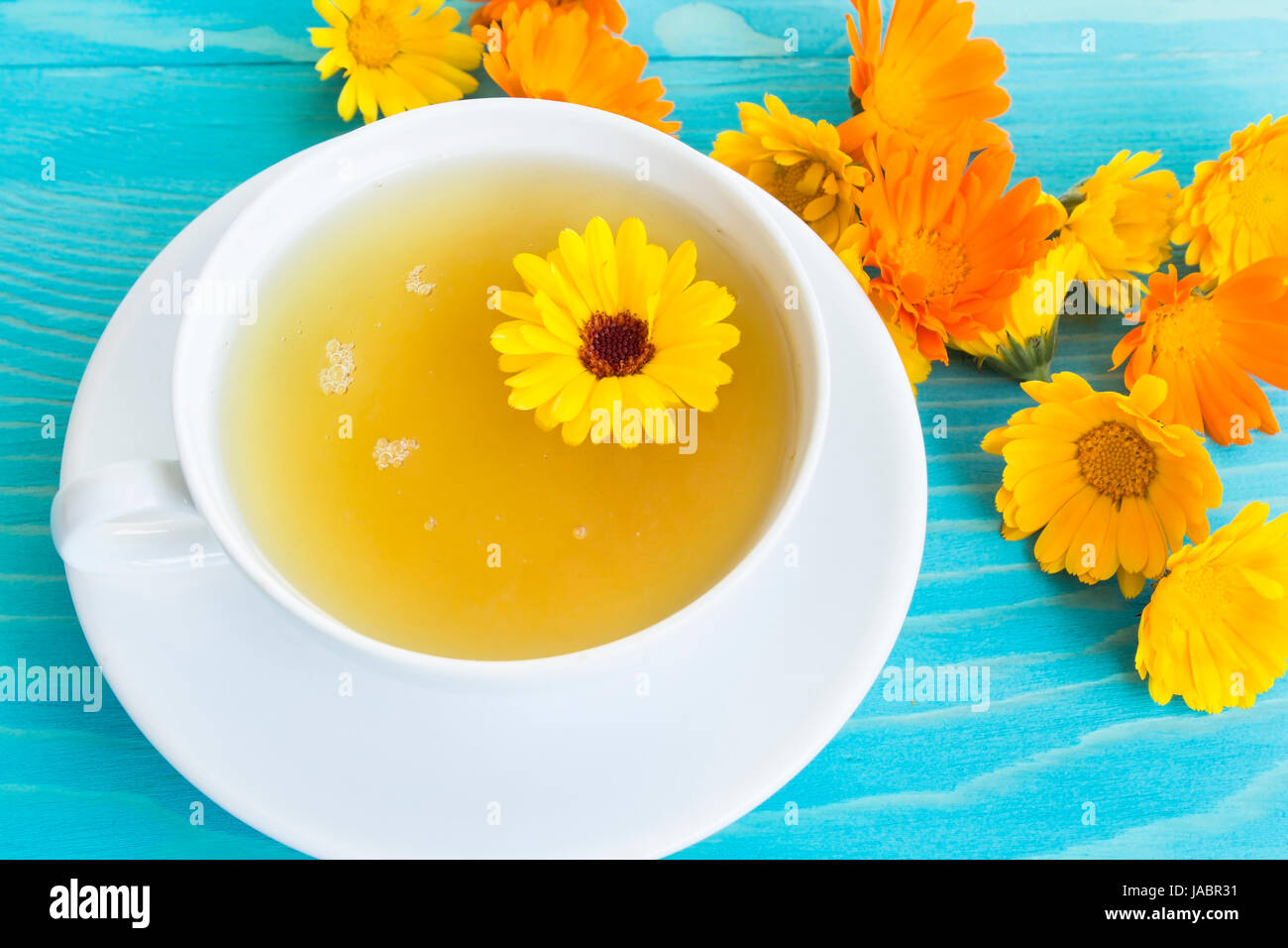 Marigold Tea , Calendula Officinalis, on a Blue Background Stock Photo ...